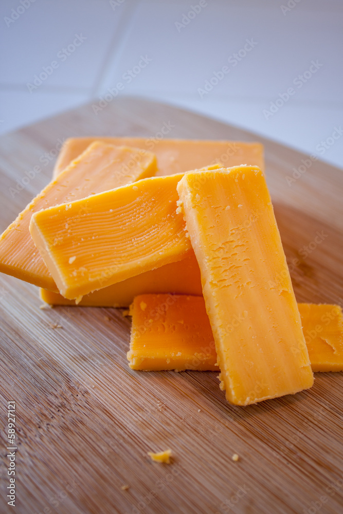 Cheddar Cheese Block and Slices Stock Photo | Adobe Stock