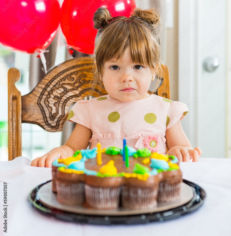 Girl Sitting In Front Of Birthday Cake Stock 写真 | Adobe Stock