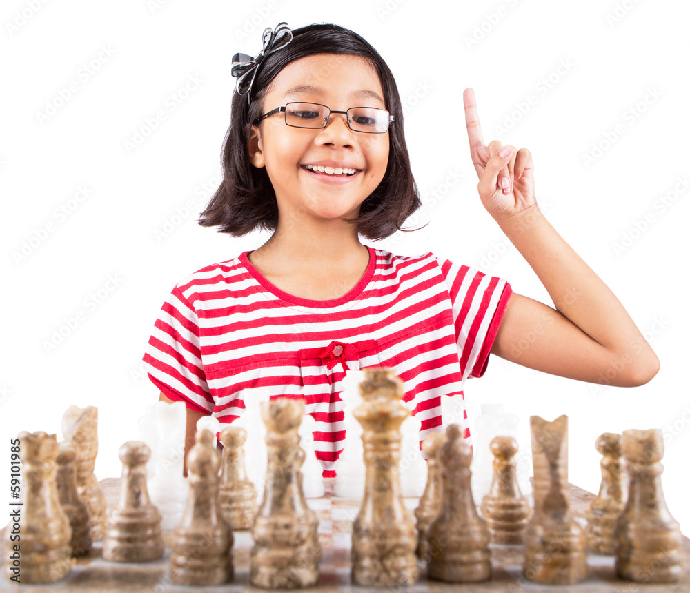 Little girl playing stone made chess set Stock Photo | Adobe Stock