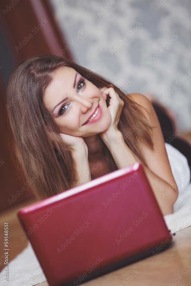 Sexy Girl Lying In Front Of Laptop Stock Photo | Adobe Stock
