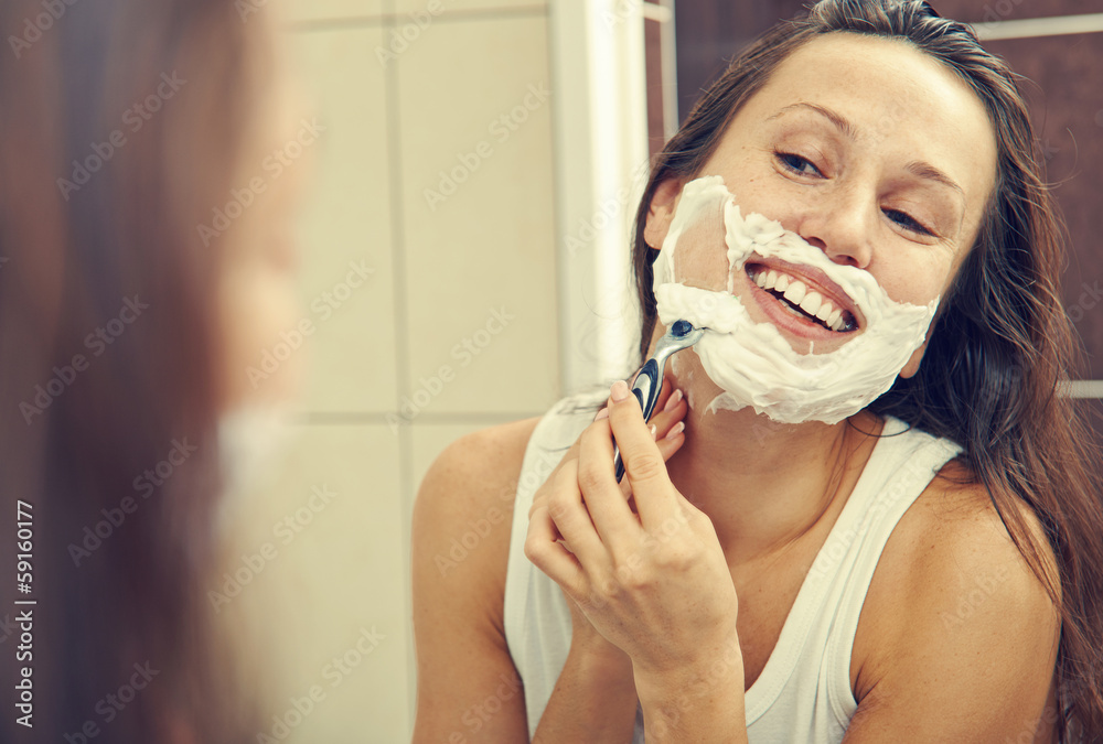 woman shaving her face Stock Photo | Adobe Stock