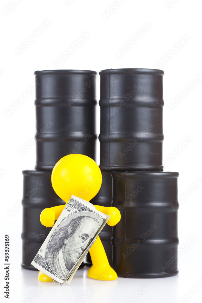toy man stand at butts with oil and holds many money. Stock Photo ...