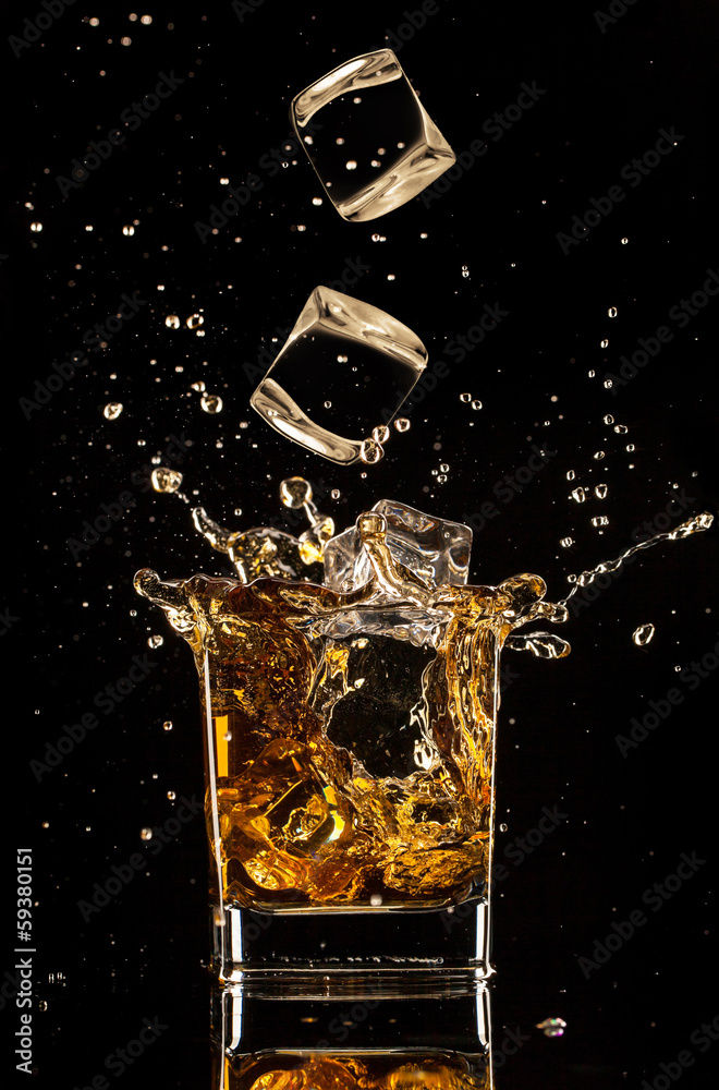 Splashing whiskey Stock Photo | Adobe Stock