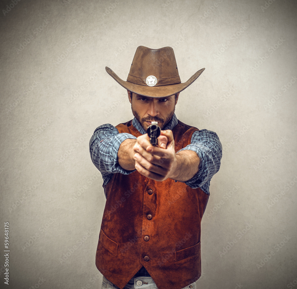 Shooting Cowboy Stock Photo | Adobe Stock