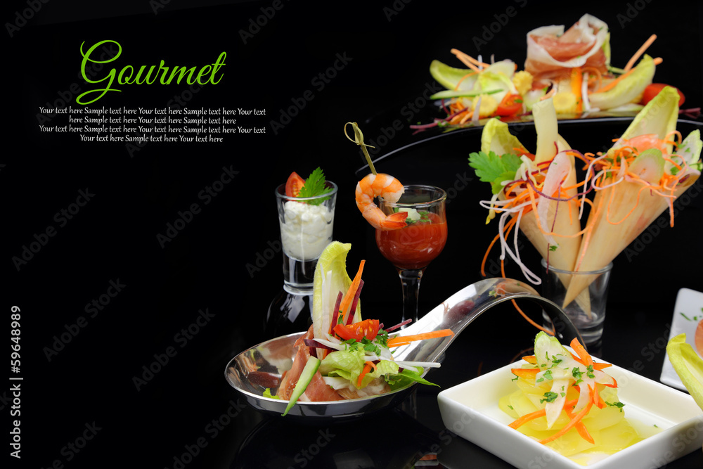 Various gourmet dishes with copy-space on black background Stock Photo ...