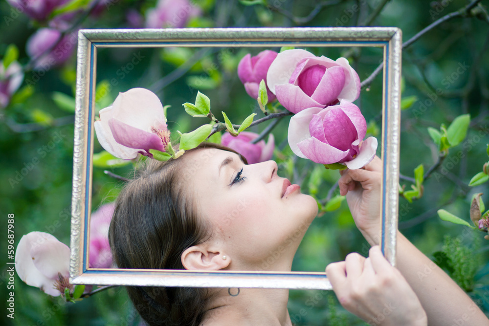Beautiful young model framing herself with an old picture frame Stock ...
