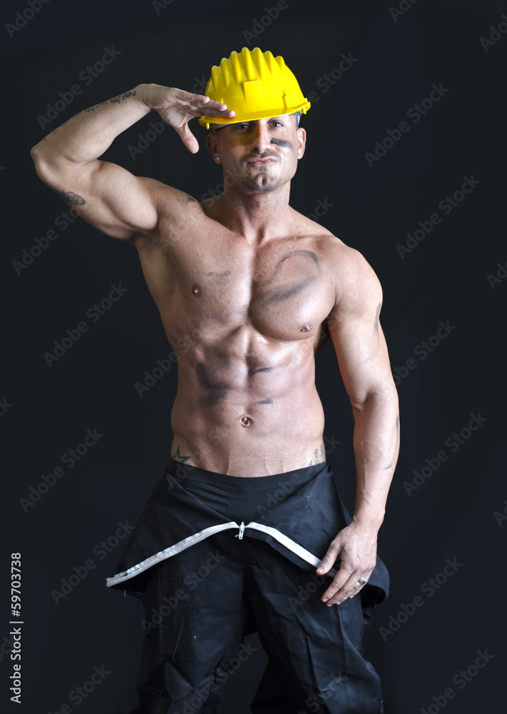Shirtless muscular construction worker with coverall and hardhat Stock ...
