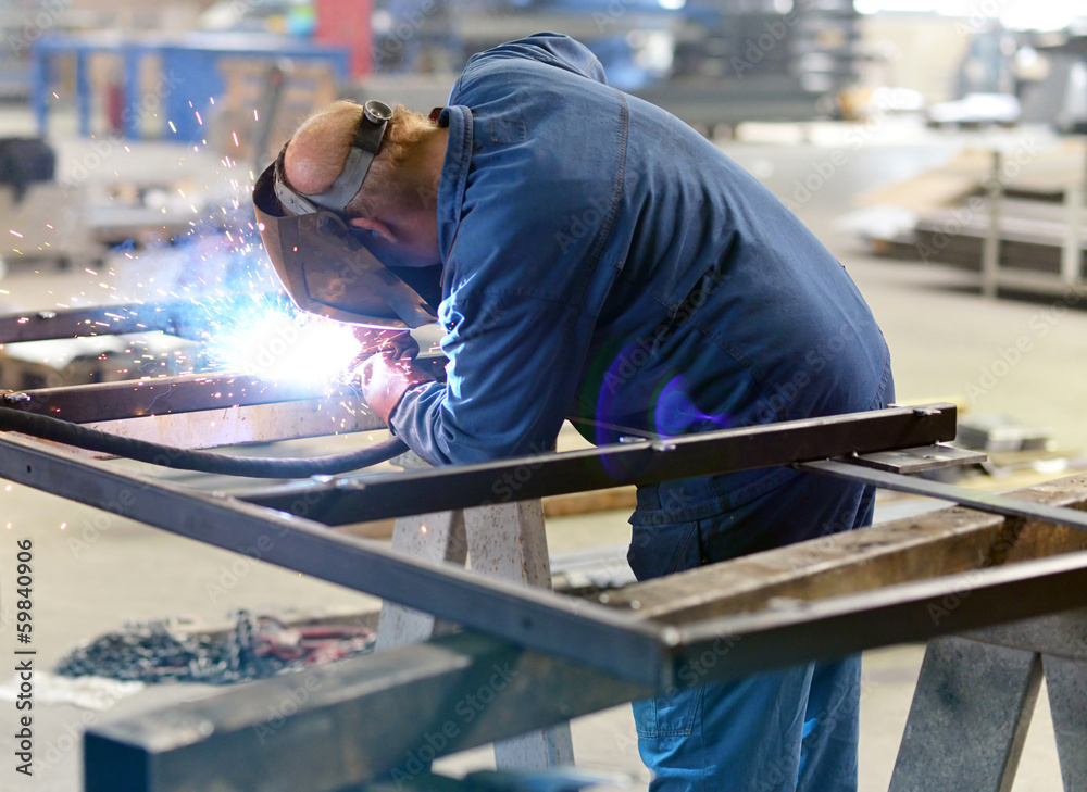 Schweißer im Stahlbau // Welder Worker Stock Photo | Adobe Stock
