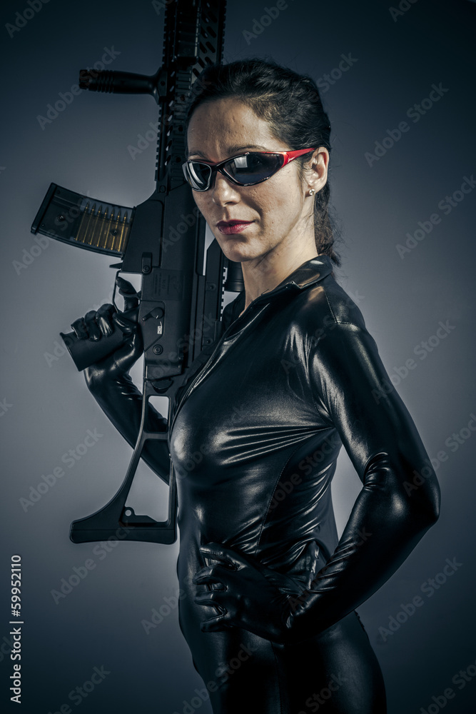 Machine gun, Sexy girl military woman posing with guns. Stock Photo ...