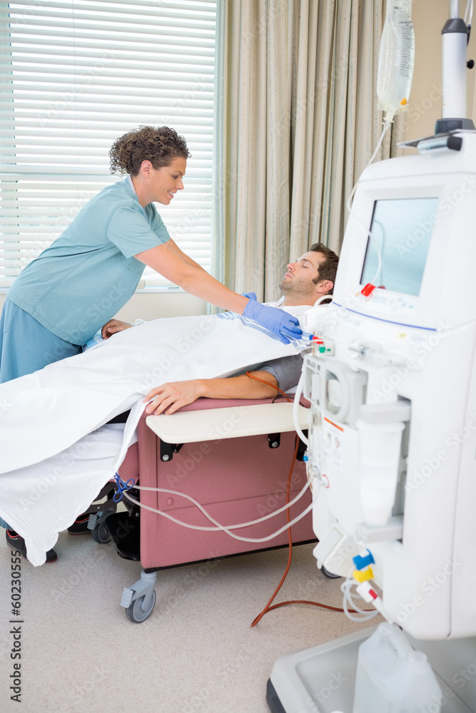 Nurse Setting up Dialysis on male patient Stock Photo | Adobe Stock
