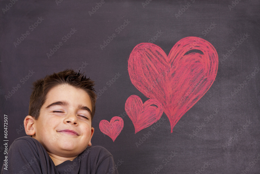 child drawing a red heart on the Board Stock Photo | Adobe Stock
