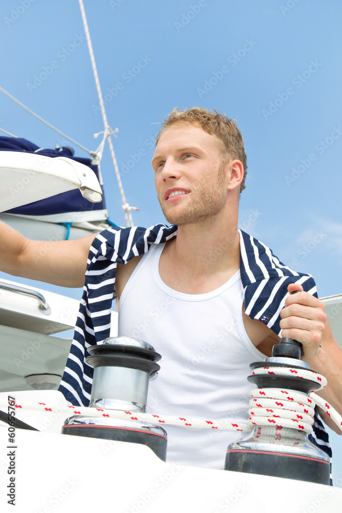 Segler auf seiner Segelyacht in maritimen Outfit Stock Photo | Adobe Stock