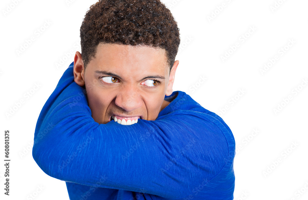 Crazy, insane young man biting his arm Stock Photo | Adobe Stock