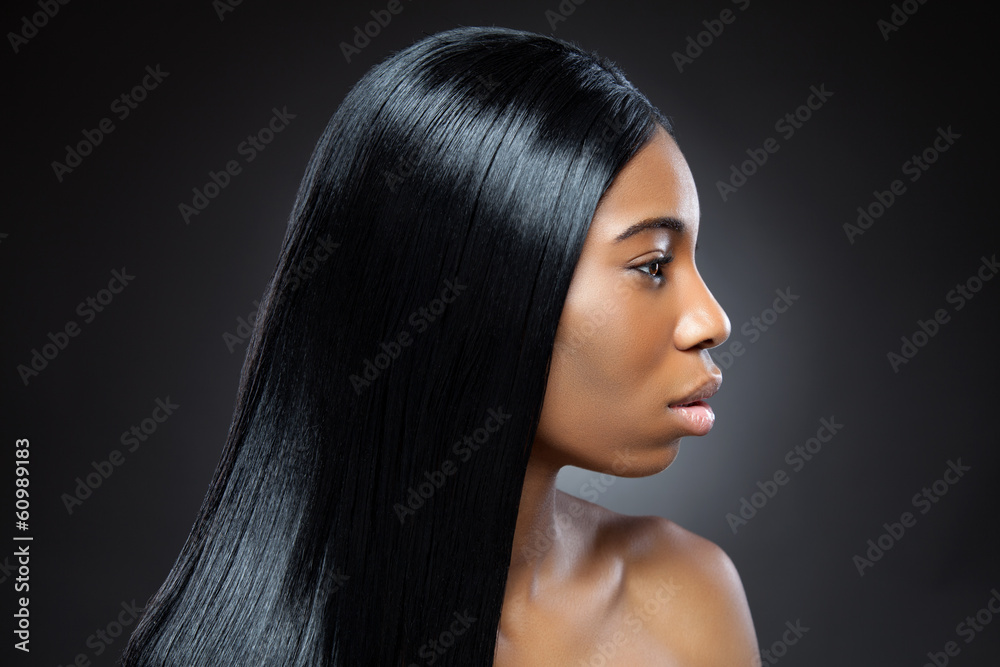 Beautiful black woman with long straight hair Stock Photo | Adobe Stock