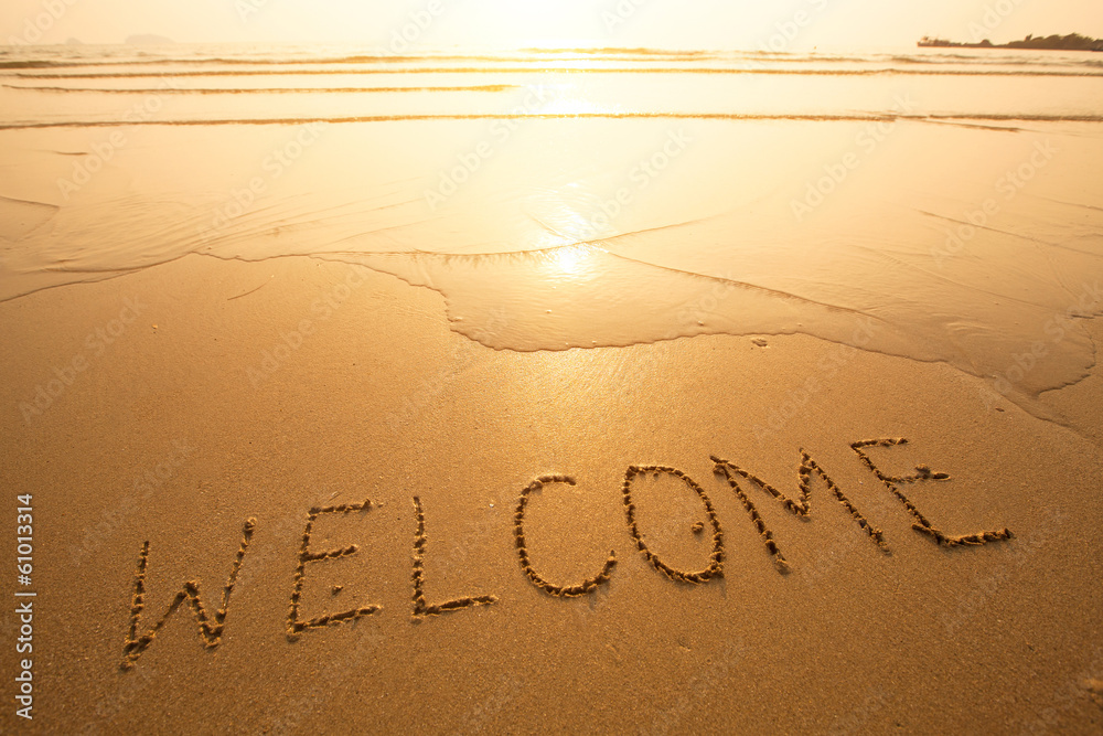 Welcome, texture on the beach sand. Stock Photo | Adobe Stock