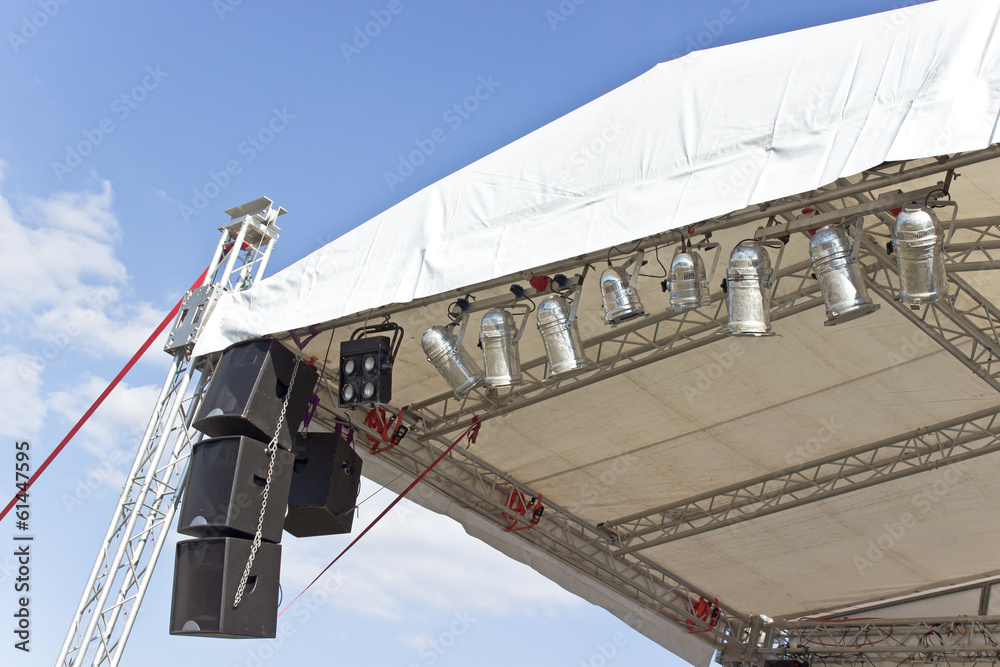 Outdoor concert stage roof construction with speakers over sky Stock ...