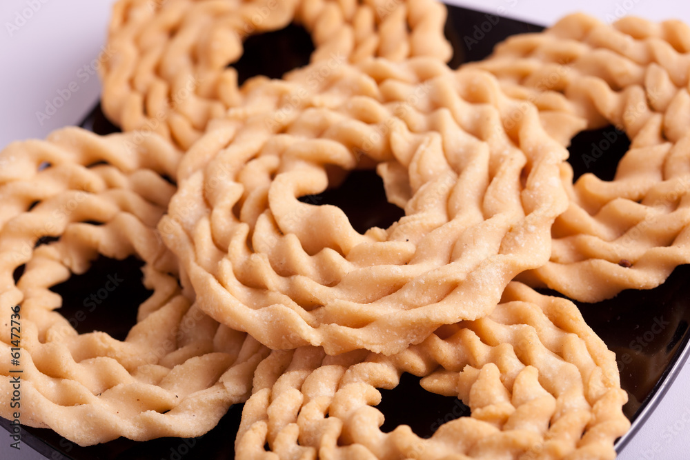 Murukku is a savoury snack popular in South India. Stock Photo | Adobe ...
