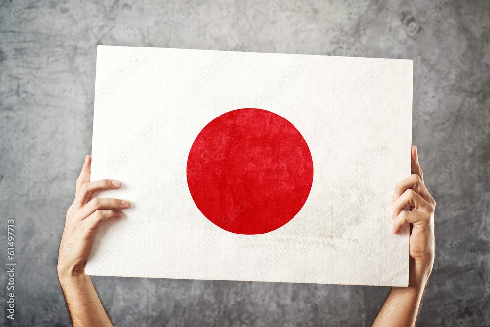 Japan flag. Man holding banner with Japanese Flag. Stock Photo | Adobe ...