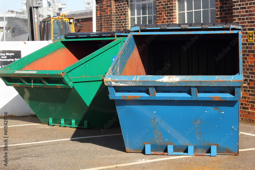 Different colored Industrial waste skips for recycling of waste Stock ...