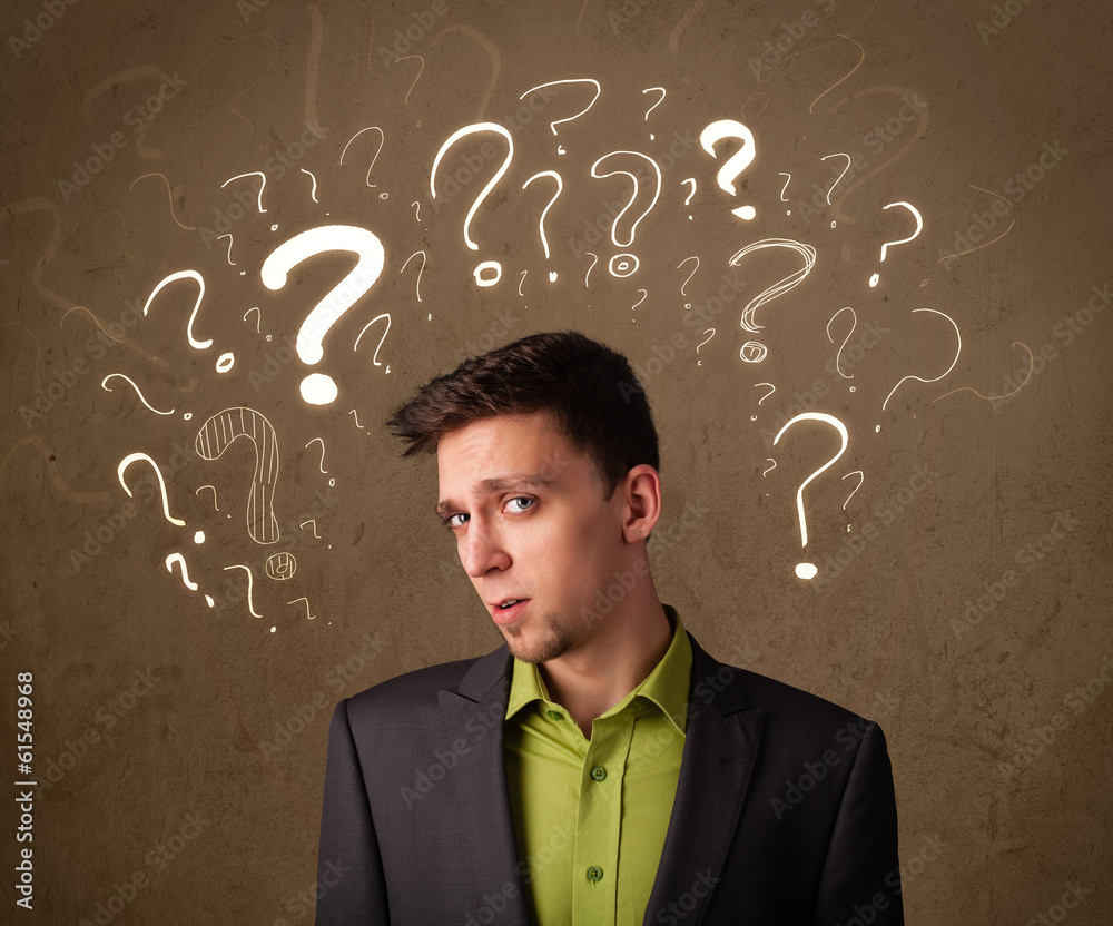 man with question mark symbols around his head Stock Photo | Adobe Stock