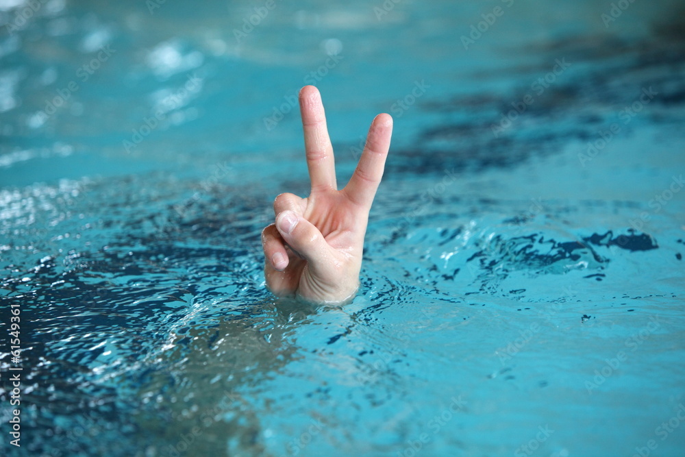 victory or peace symbol,above water surface - body language Stock Photo ...