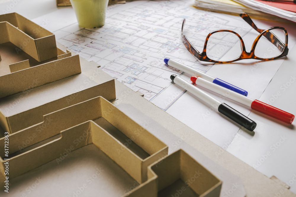 Building model and drafting tools on construction plan. Stock Photo ...
