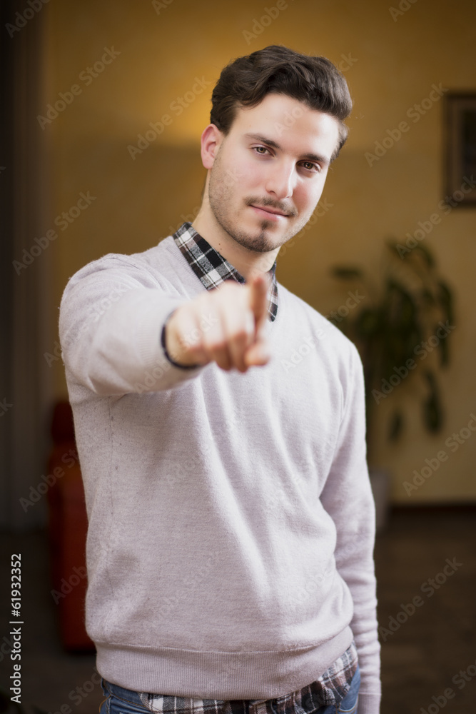 Handsome young man pointing finger at you, smiling Stock Photo | Adobe ...