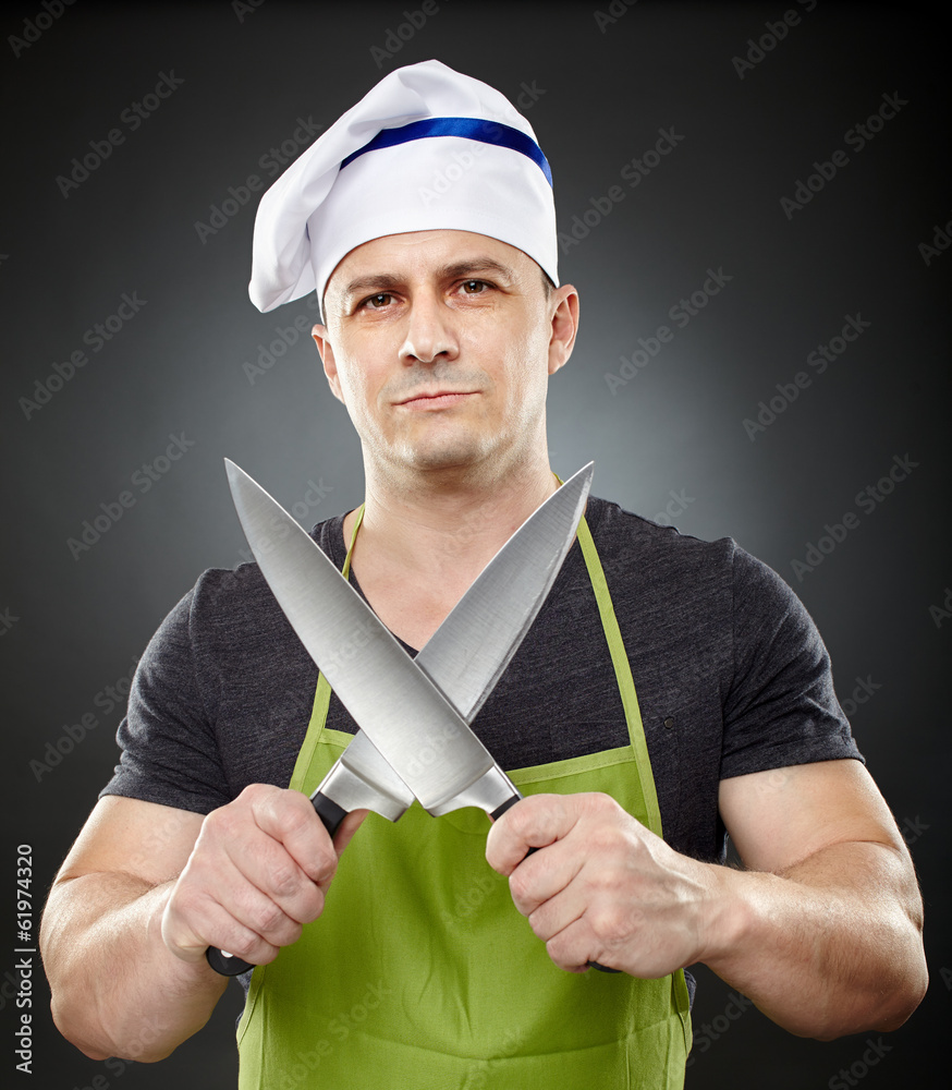 Man cook holding two big sharp knives Stock Photo | Adobe Stock