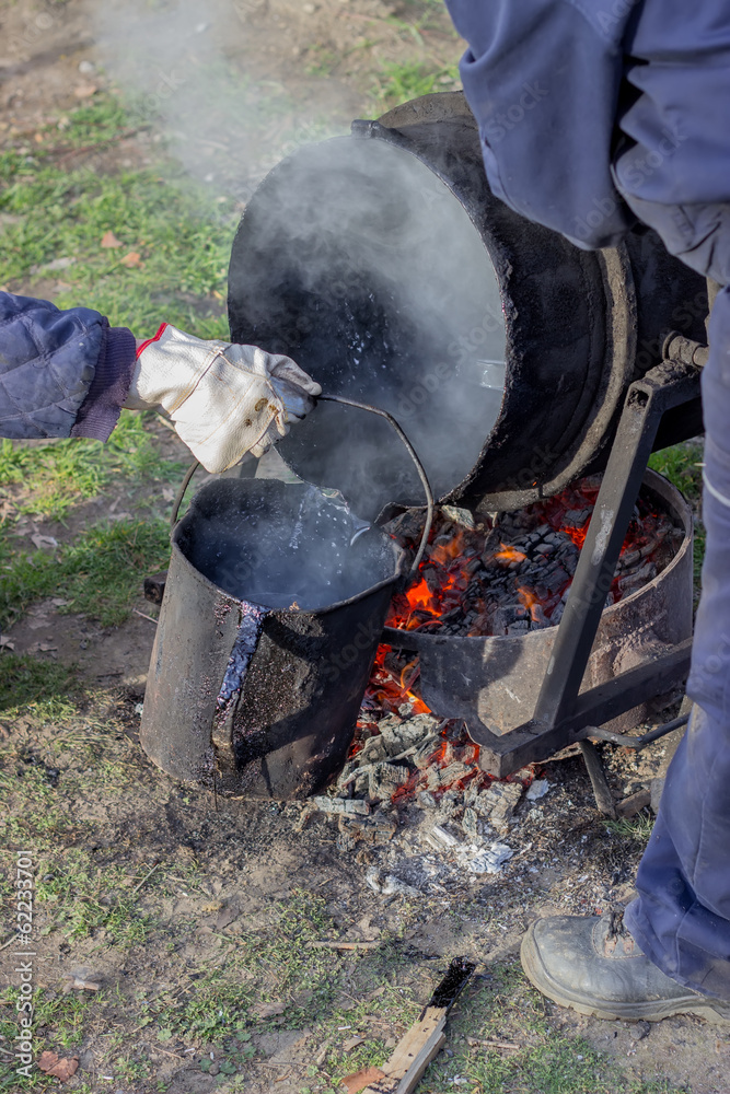 pouring tar from the melting device 2 Stock-Foto | Adobe Stock