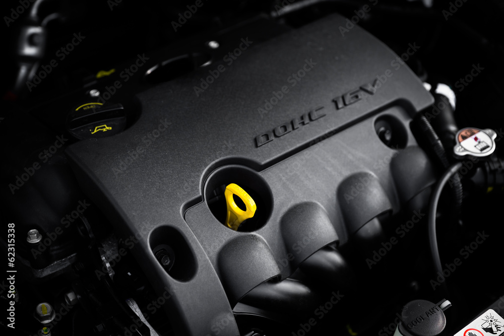 car engine dipstick, plastic engine casing Stock Photo | Adobe Stock