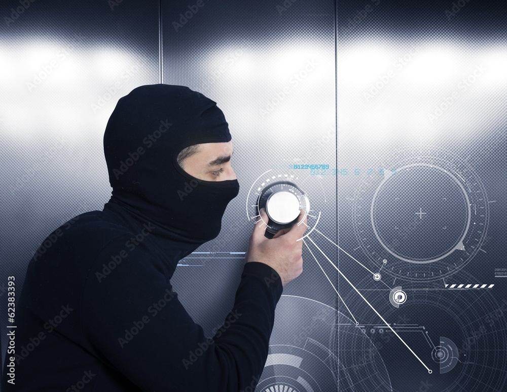 Thief tries to open a safe Stock Photo | Adobe Stock