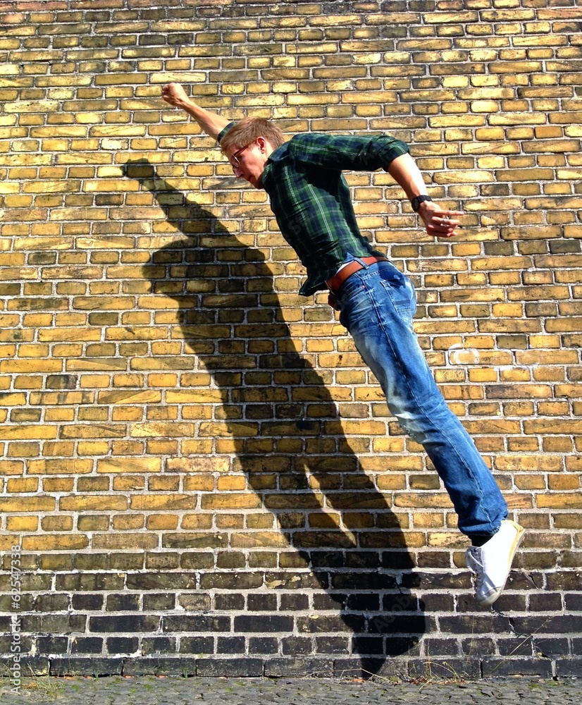 man jump wall Stock Photo | Adobe Stock