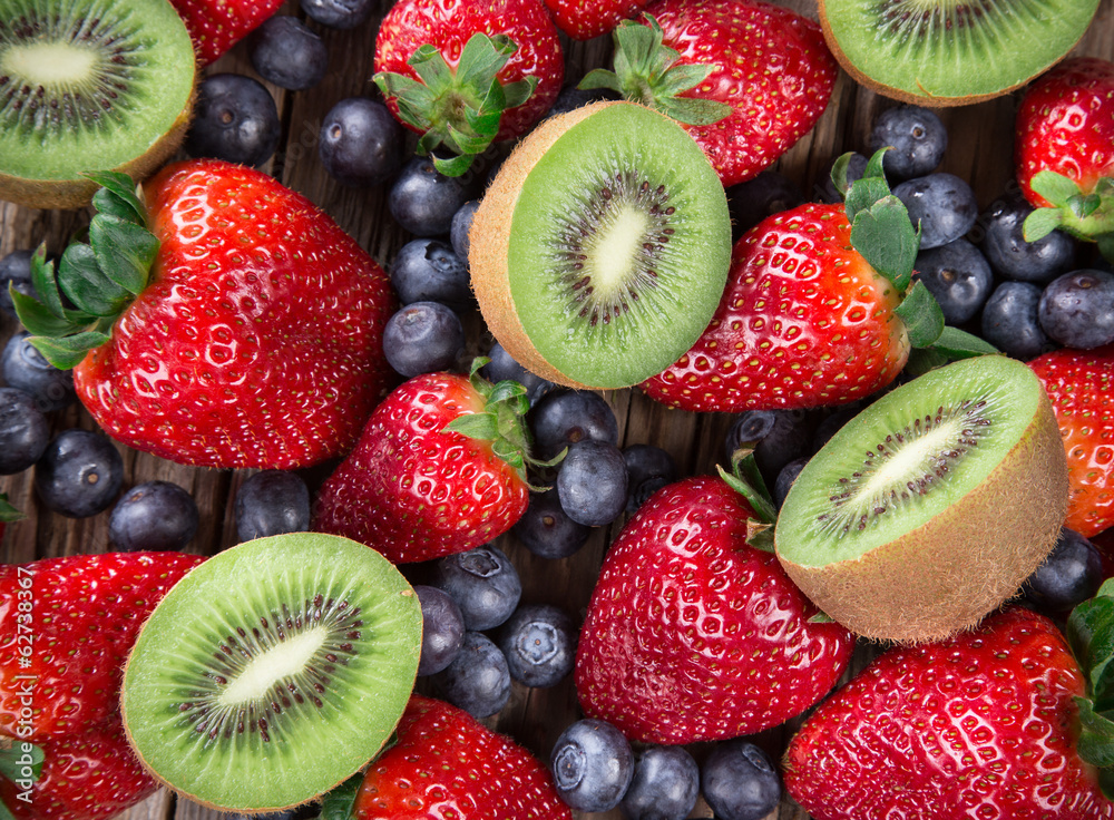 berries on wooden background. Stock Photo | Adobe Stock