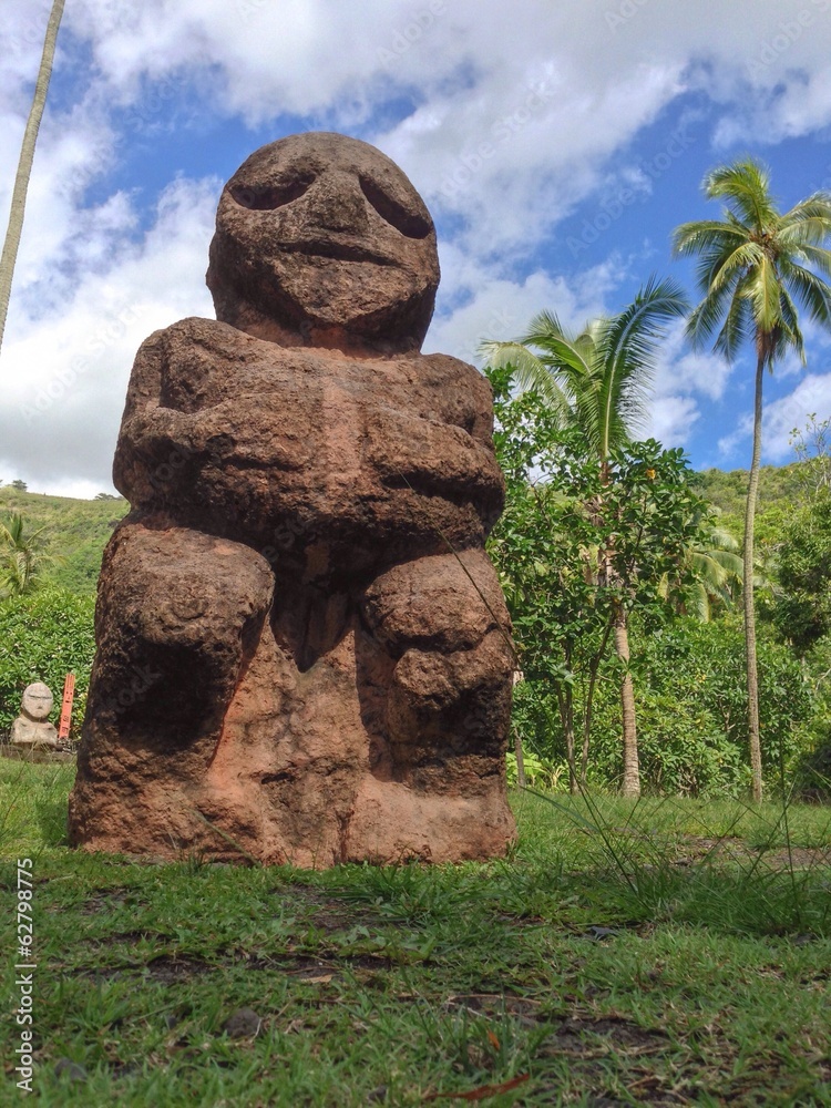 statue of god Tiki in ancient temple ruins on Tahiti Stock Photo ...
