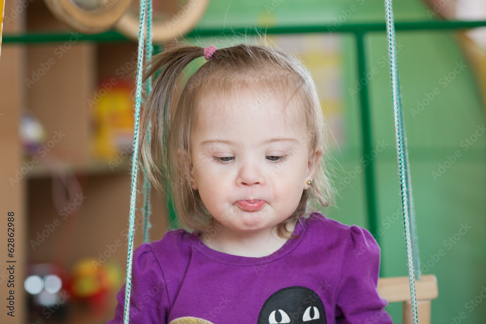 Emotions of a little girl with Down syndrome Stock Photo | Adobe Stock