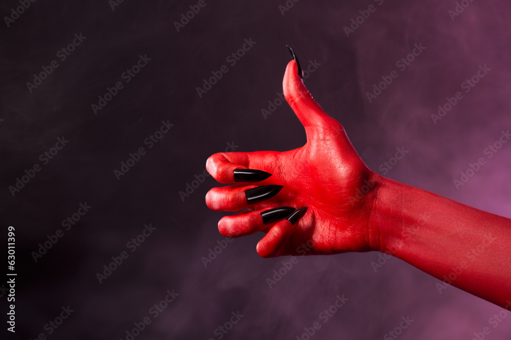 Red devil hand showing thumbs up Stock Photo | Adobe Stock