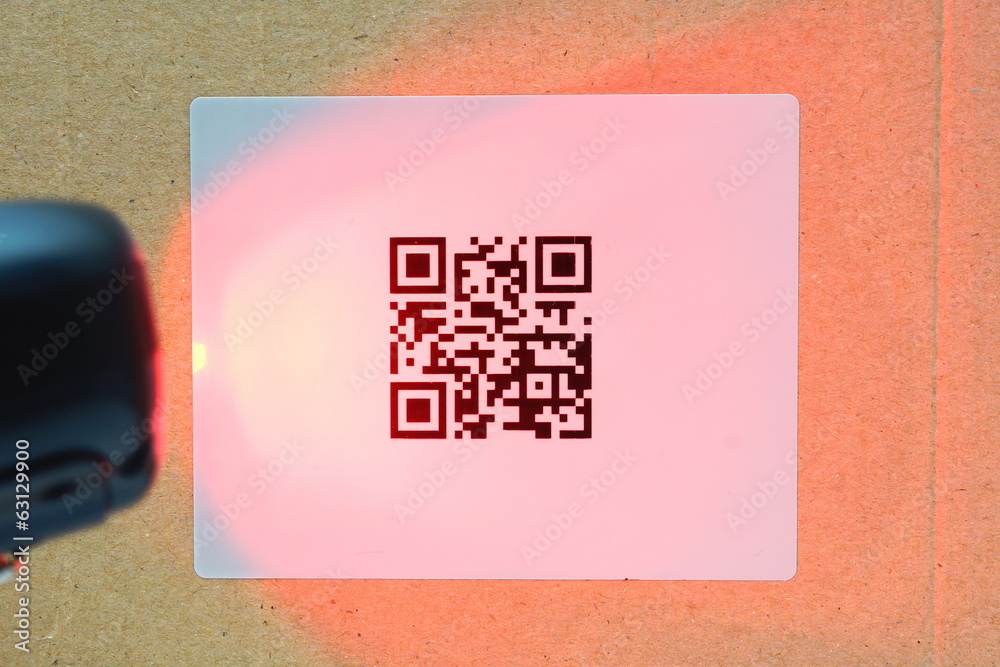 scanning QR code .label on the carton with laser Stock Photo | Adobe Stock