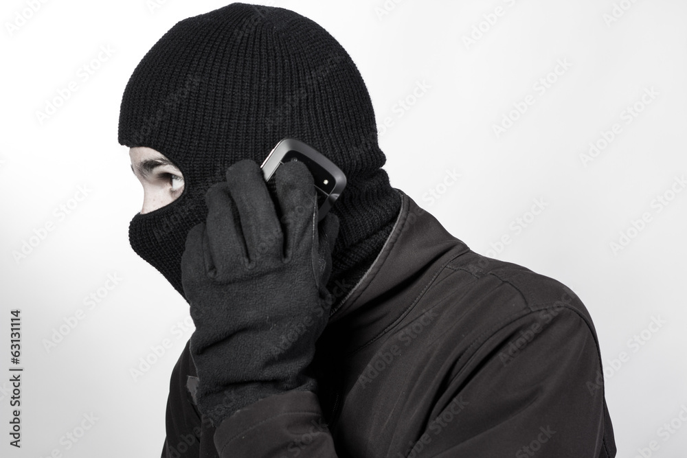 Thief with stolen phone Stock Photo | Adobe Stock