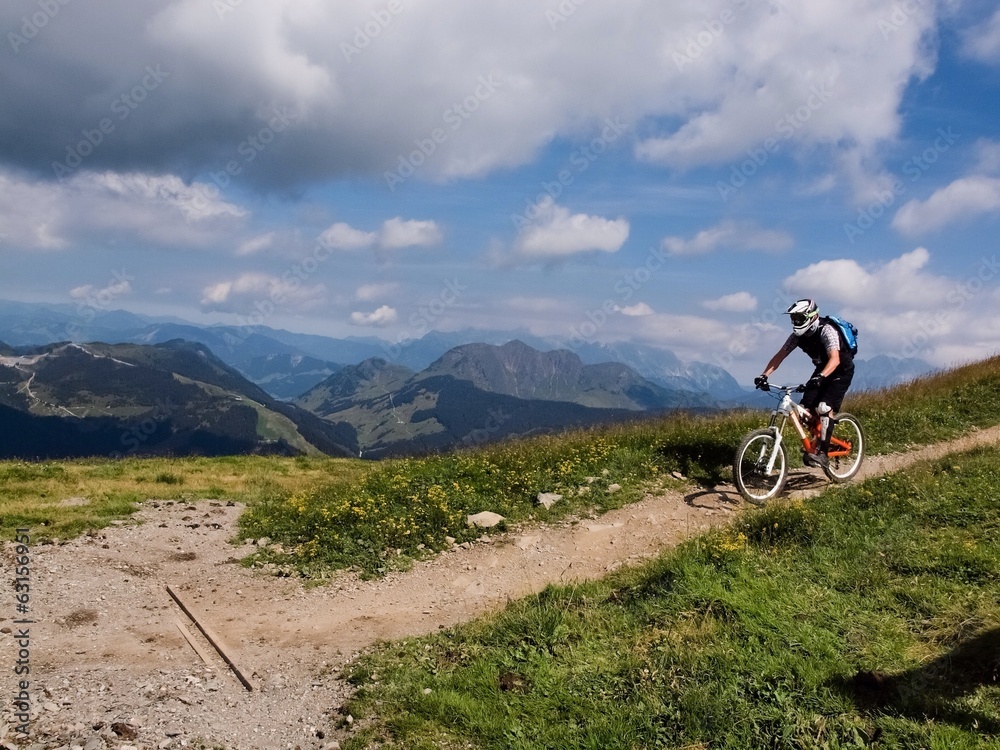 mountain cyclist in front of montain landscape Stock Photo | Adobe Stock
