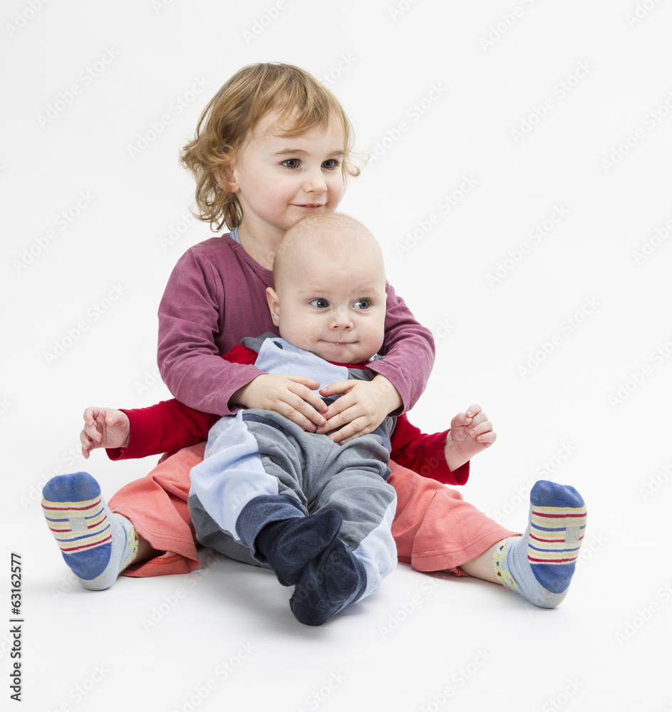 siblings isolated in light background Stock Photo | Adobe Stock