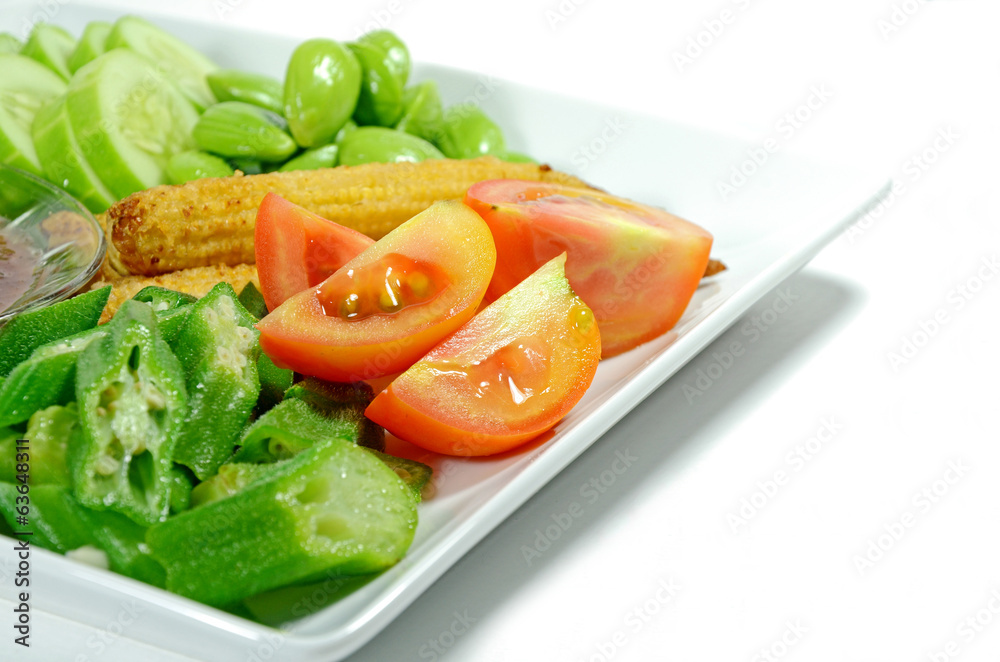 Mixed vegetable menu with sliced cucumber, tomatoes, grilled baby corn ...