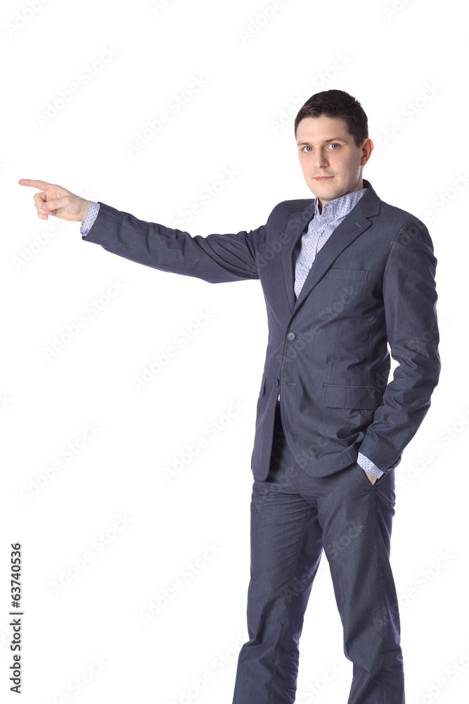a young man in a gray suit pointing toward Stock Photo | Adobe Stock