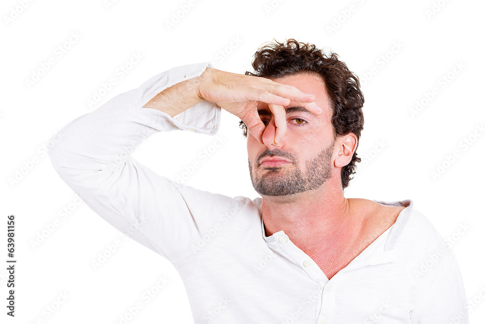 That stinks. Man pinches nose, doesn't like the smell Stock Photo ...
