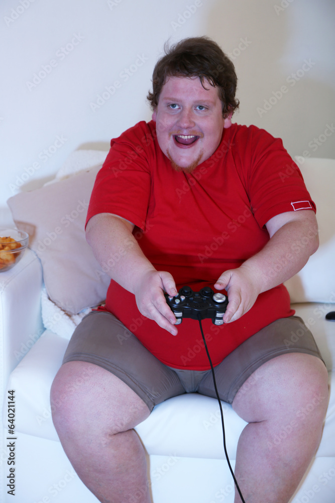Fat man playing video games on home interior background Stock Photo ...