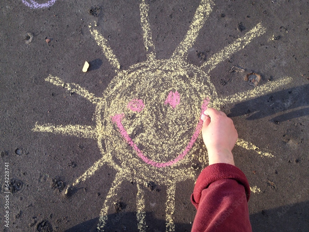 child hand drawing sun with chalk Stock Photo | Adobe Stock