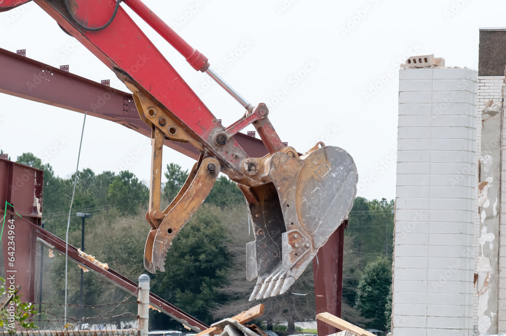 Photo & Art Print wreck excavator at work demolishing a building wall ...