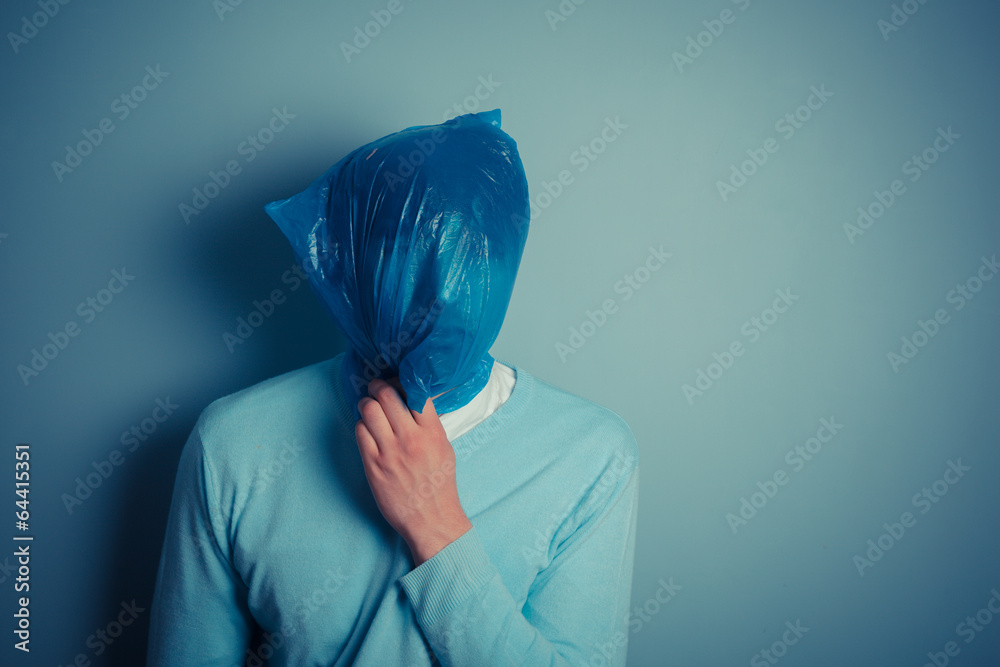 Man with a plastic bag over his head Stock Photo | Adobe Stock