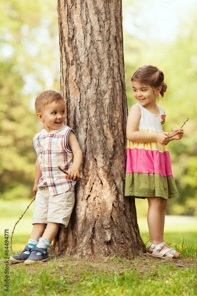 Happy little children playing in the park. Stock Photo | Adobe Stock