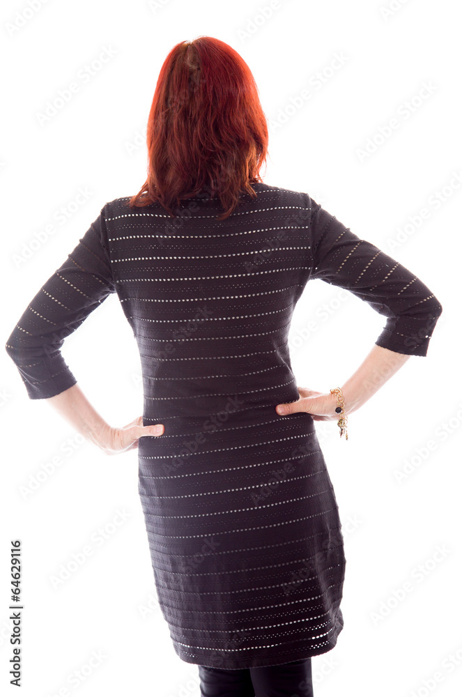 Rear view of a mature woman standing with her arms akimbo Stock Photo ...