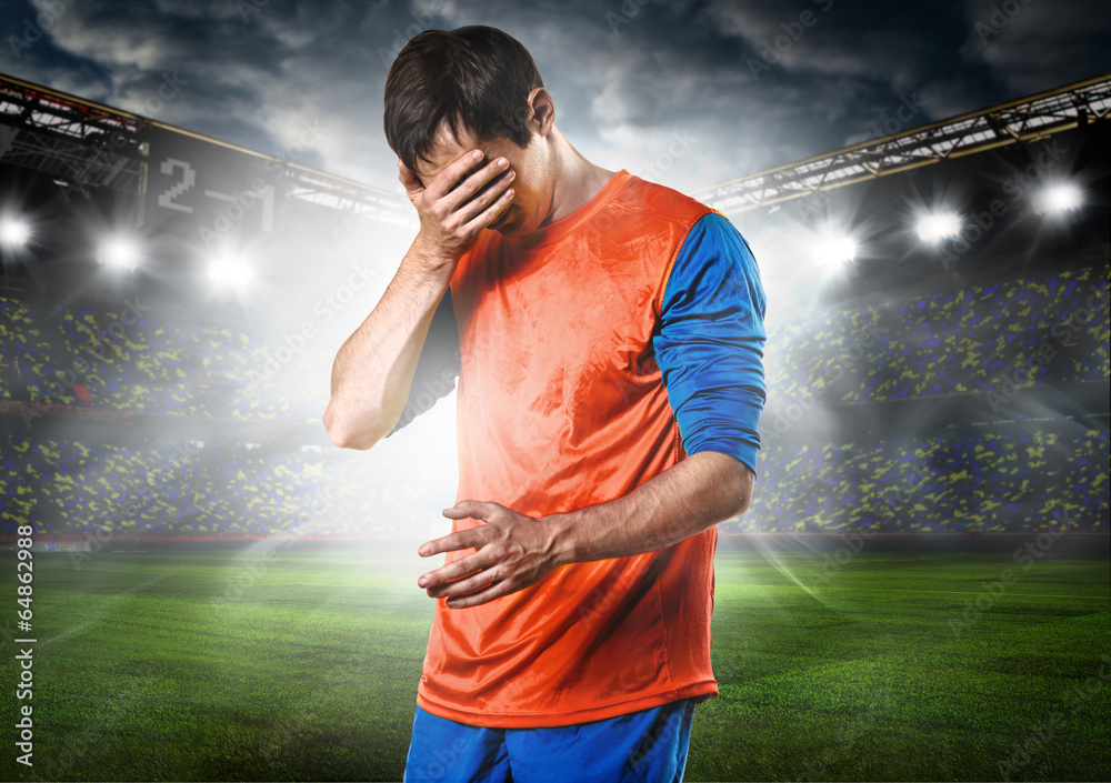sad soccer player Stock Photo | Adobe Stock